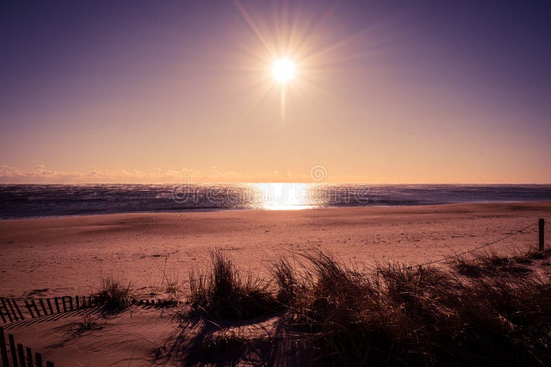 Sun Over a Bitter Cold Beach Stock Photo - Image of beach, outdoors ...