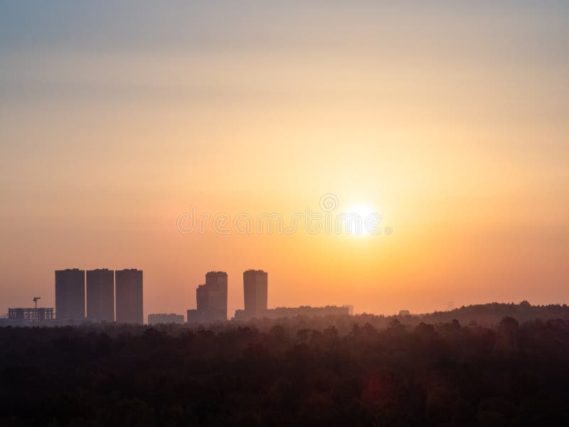 Sun Over City and Forest in Yellow Sunrise Stock Image - Image of ...