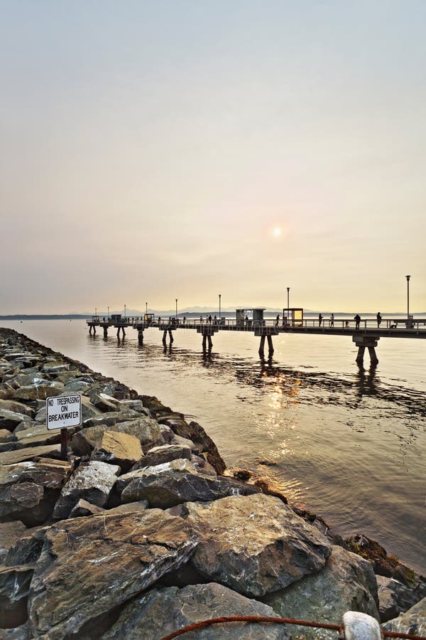 Sun over the Edmonds pier stock image. Image of sunset - 20258449