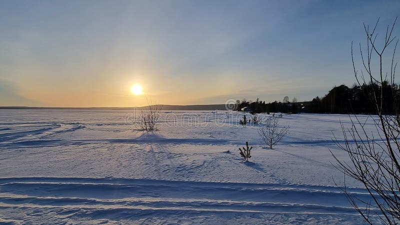 The Sun Over the Snow-covered Lake in Winter Stock Photo - Image of ...