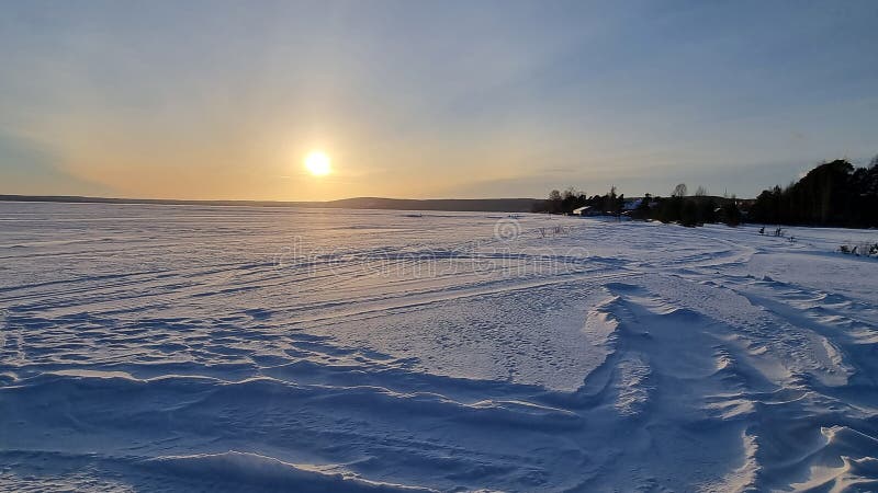 The Sun Over the Snow-covered Lake in Winter Stock Photo - Image of ...
