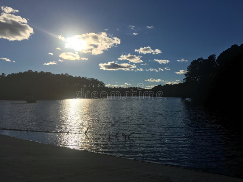 Sun Peaking Clouds Over Water Stock Photos - Free & Royalty-Free Stock ...