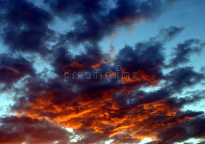Sun Peaking through Clouds at Sunset Stock Image - Image of colours ...