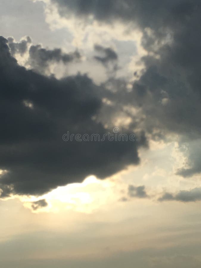 Sun Peaking through the Clouds Stock Image - Image of multicolored ...