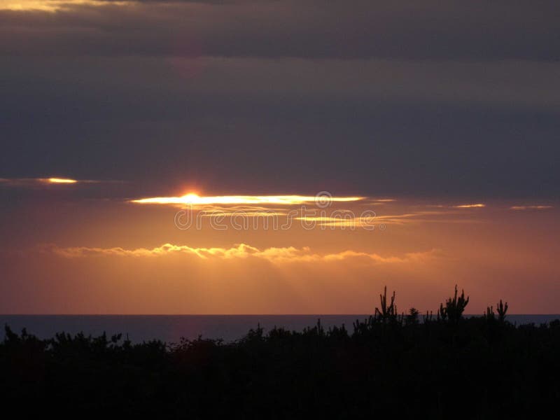Sun Peaking Through The Clouds Stock Image - Image of sunset ...