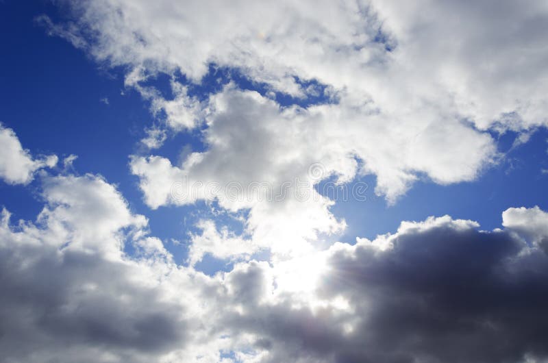 The Sun Peeking through the Clouds in the Sky Stock Image - Image of ...