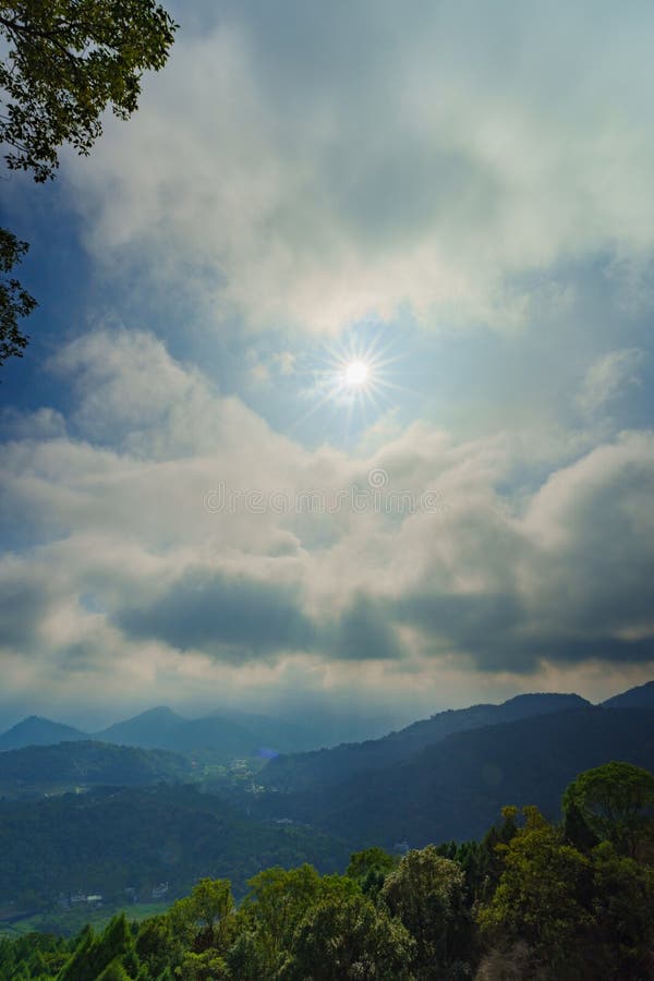 Sun Show the Radiance through the Clouds and Mountains Stock Photo ...