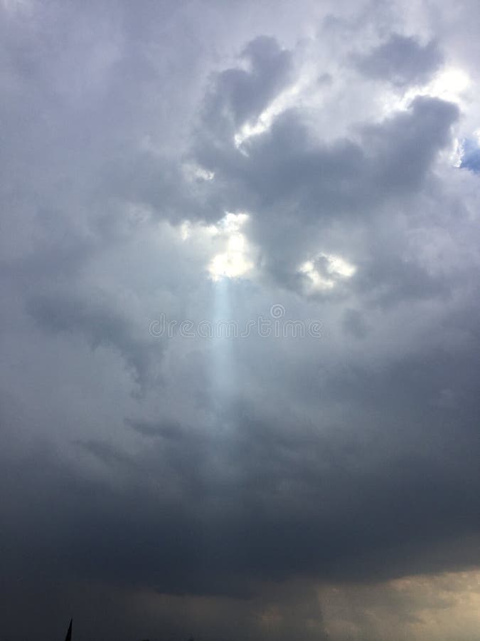 A Sun Ray Across the Clouds Stock Image - Image of perfect, clouds ...