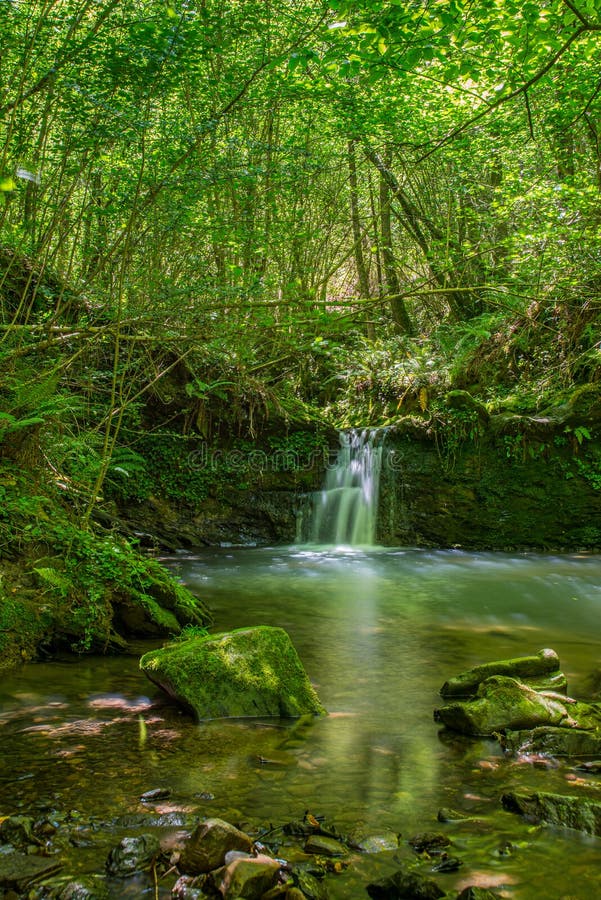 Sun Ray Lights Over a Small Waterfall in a River in Galdames, Basque ...