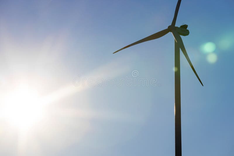 Sun ray and a wind turbine stock image. Image of modern - 242502277