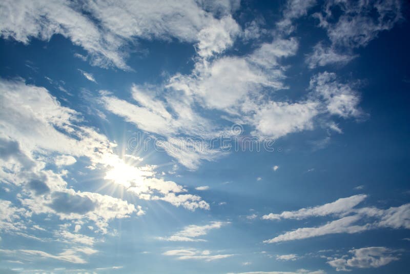 Sun Rays Against a Blue Sky in the Clouds. Stock Image - Image of ...
