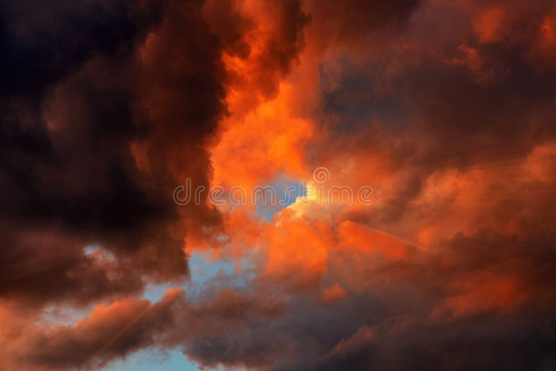Sun Rays Beaming through Moody Clouds at Dramatic Sky in Summer Sunset Stock Photo - Image of ...