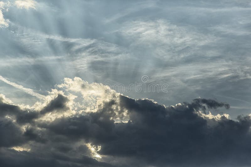 Sun rays behind clouds stock photo. Image of time, eternal - 250073162