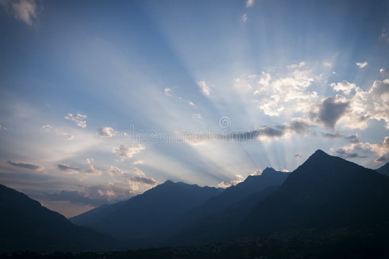 Sun Rays Behind the Mountains Stock Image - Image of sunbeams, nature ...
