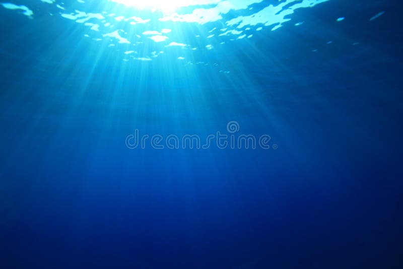 Sun rays in blue water stock photo. Image of texture - 15075914
