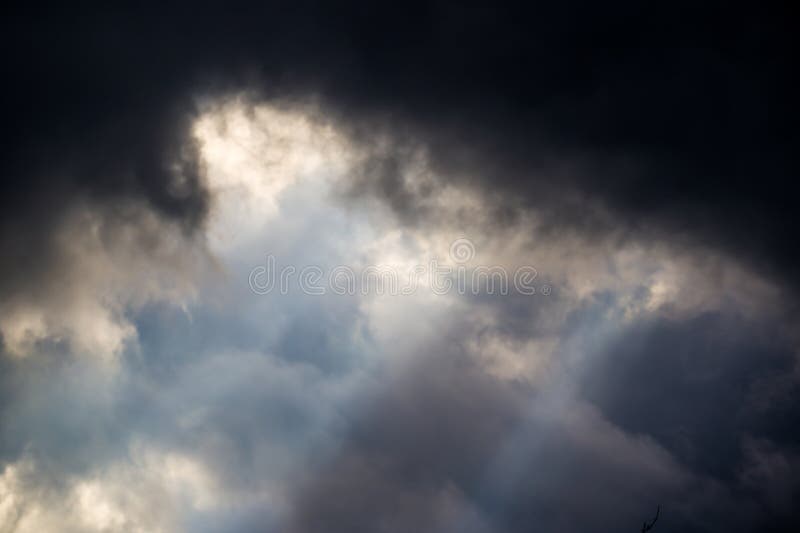 The Sun Rays Break through Dark Thunder Clouds Stock Image - Image of ...