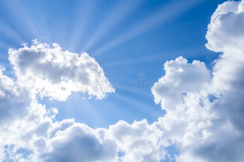 The Sun Rays Breaking through the Clouds on Blue Sky Stock Image ...