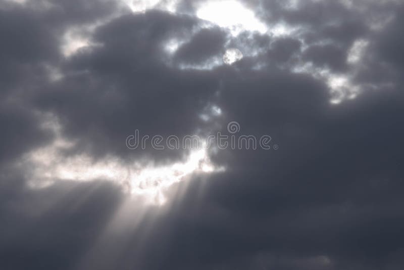 Sun Rays Breaking through the Layer of Dark Clouds. Stock Image - Image ...