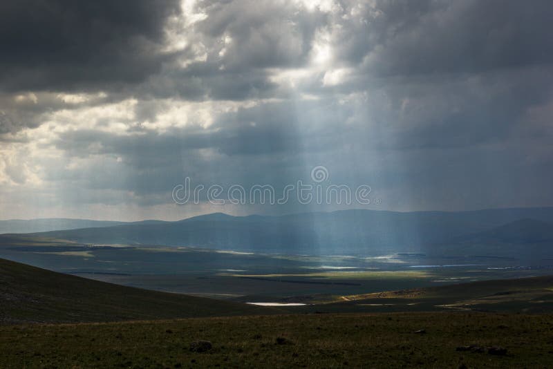 Sun Rays Breaking through a Rain Cloud Front Stock Photo - Image of ...