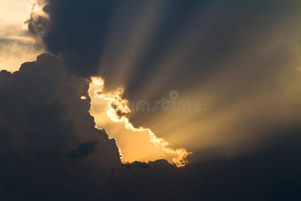 Sun rays through cloud stock image. Image of heaven, outdoors - 24713061