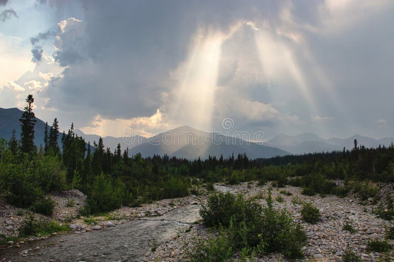 Sun Rays through Clouds Shining on a Mountain in Alaska Stock Image ...
