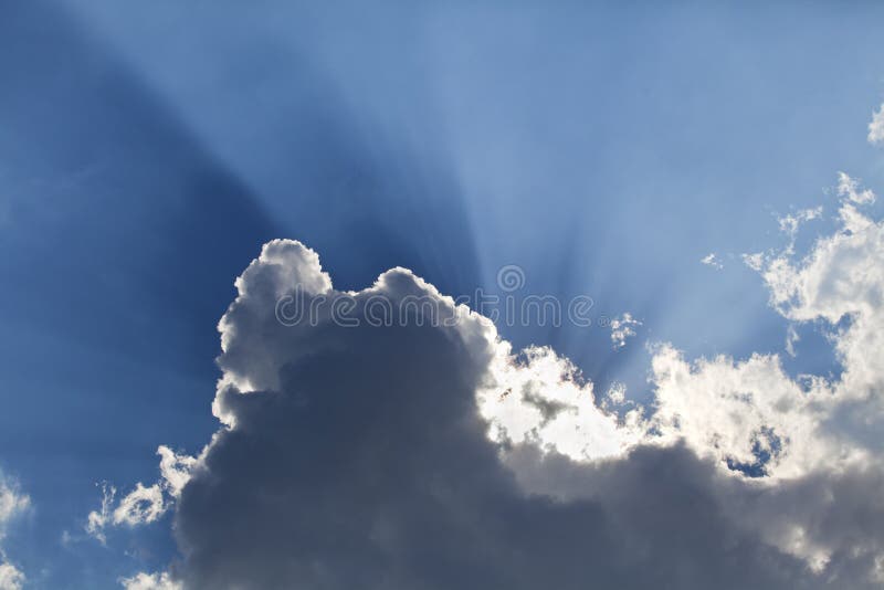 Sun rays through a cloud stock image. Image of scenics - 61892383
