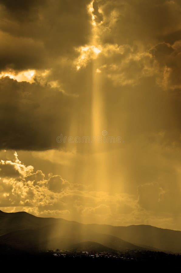 Sun Rays in Clouds and Mountains Stock Photo - Image of dramatic ...