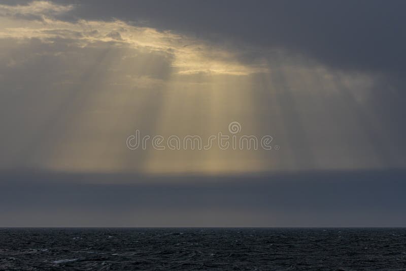 Sun Rays and Clouds Over the Sea Stock Photo - Image of ocean, rainbow ...