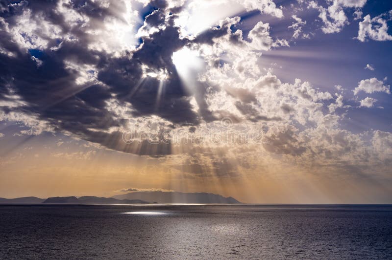 Sun Rays through the Clouds Stock Image - Image of light, honeymoon ...