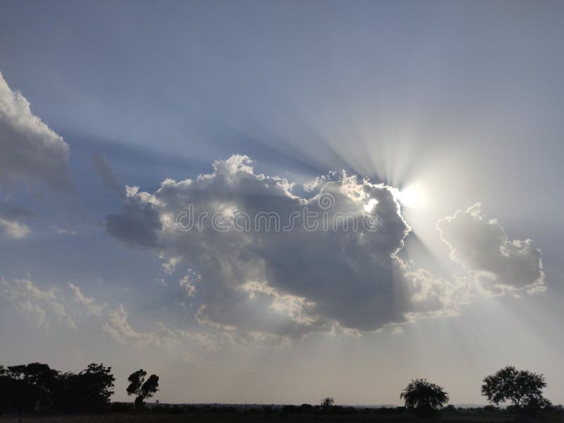 Sun Rays Coming Out of the Clouds Stock Photo - Image of wind, evening ...