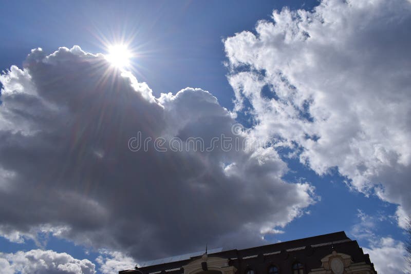 The Rays of the Sun Emerging from Behind the Clouds Stock Photo - Image ...