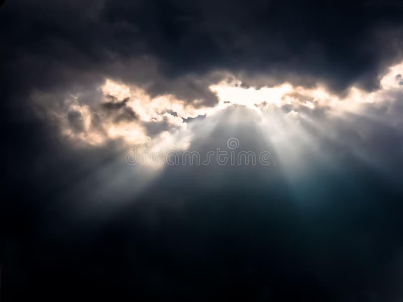 Sun Rays through Dark Clouds Stock Image - Image of dramatic, light ...