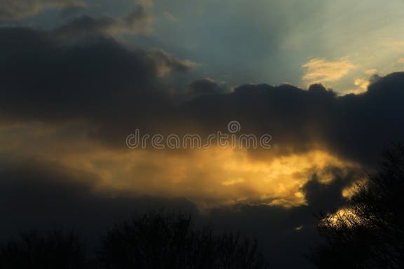 Sun Rays in Dark Clouds at Sunset Stock Image - Image of rays, colorful ...