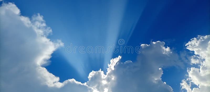 Sun Rays Emerging from Clouds at Evening Time Stock Photo - Image of ...