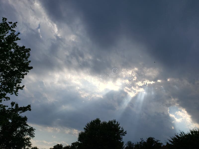 Sun rays from heaven stock photo. Image of moment, houses - 186074214