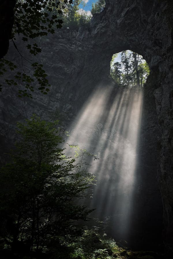 Sun rays through hole stock photo. Image of wilderness - 227880122