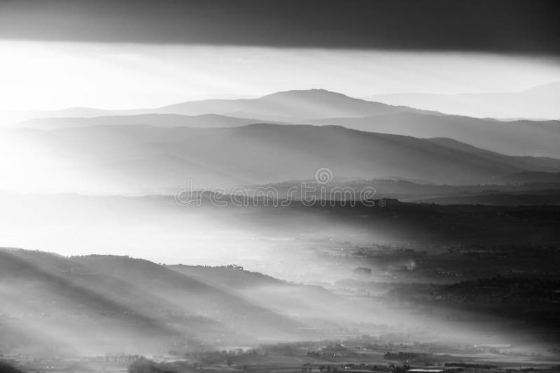 Sun Rays Over Some Mountains and Hills at Sunset Stock Image - Image of ...