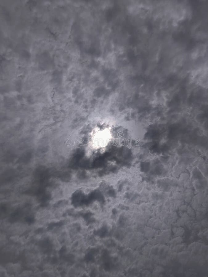 Sun Rays Pierce through Dark, Textured Clouds in a Dramatic Sky. High ...