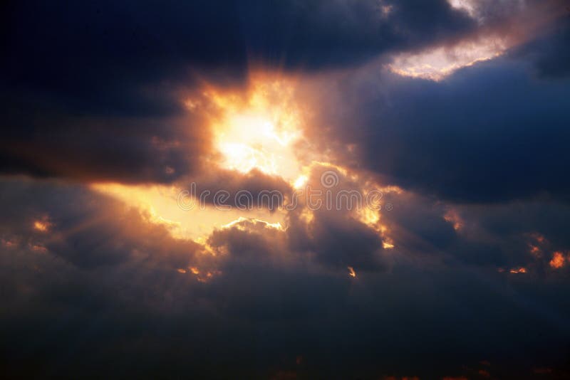 The Sun Shining through the Clouds in the Cloudy Sky and a Strong Beam ...