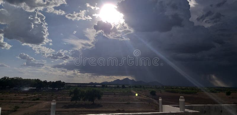 Sun Rays are Reflecting through Dark Clouds. Stock Image - Image of ...