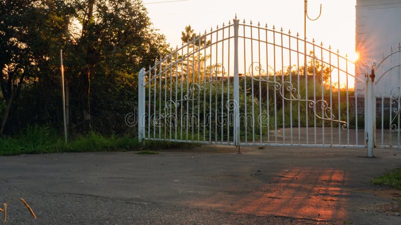 Sun Rays through the White Gate Stock Photo - Image of park, gate ...