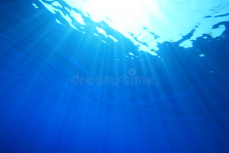 Sun rays in blue water stock photo. Image of texture - 15075914