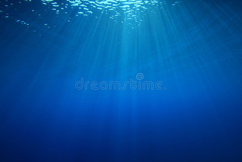 Sun rays in blue water stock photo. Image of texture - 15075914