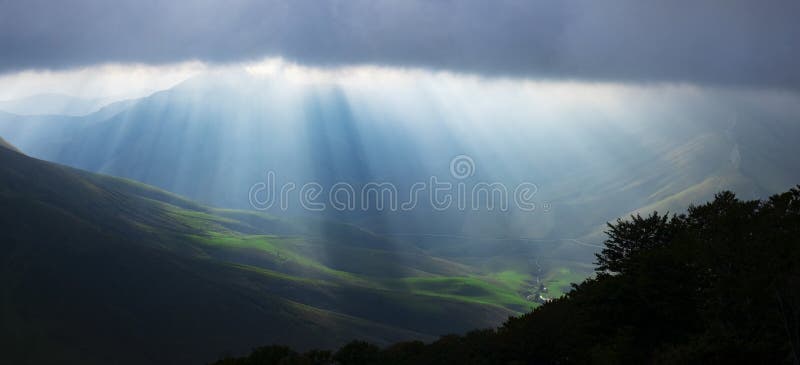 Sun Rays Seep through the Clouds in the Pyrenees Stock Image - Image of ...