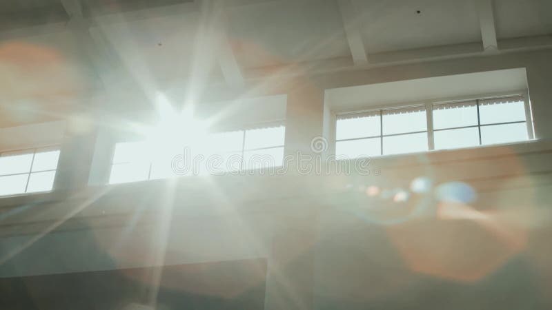 Sun Rays Shine Brightly into Windows Near White Figured Ceiling with ...