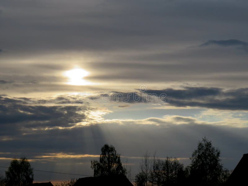 Sun Rays Shine through the Dark Clouds Stock Image - Image of horizon ...