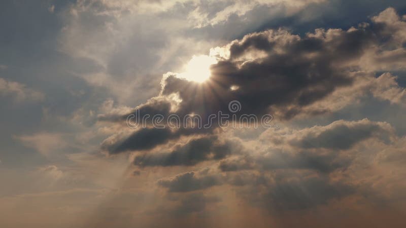 Sun Rays Shine Out from Behind Huge Clouds Stock Footage - Video of ...