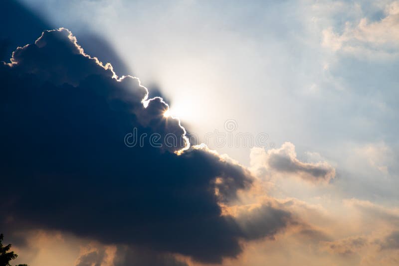 Sun Rays Shining from Behind a Big Cloud Stock Photo - Image of heaven ...