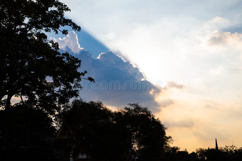 Sun Rays Shining from Behind a Big Cloud Stock Image - Image of ...