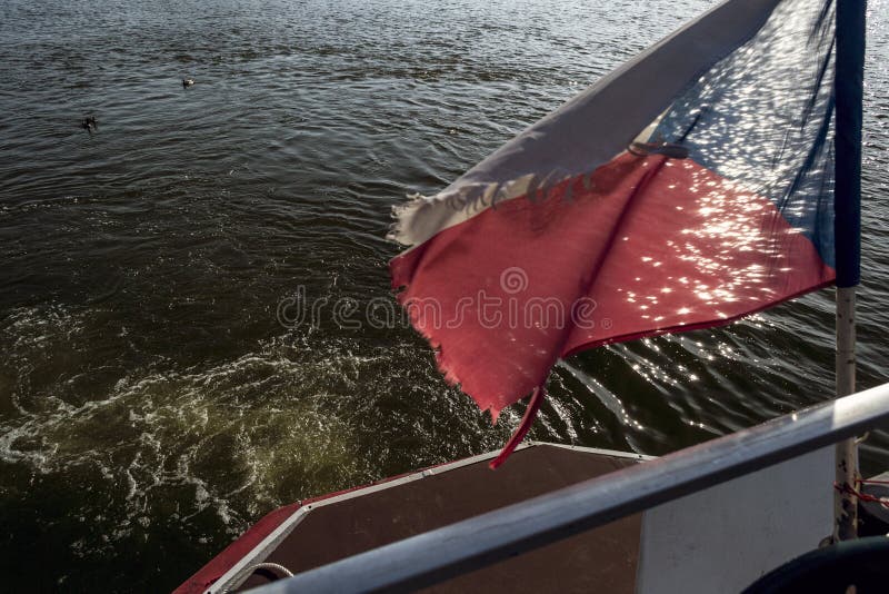 Sun Rays Shining with a Flag in the Wind on a Boat Stock Photo - Image ...